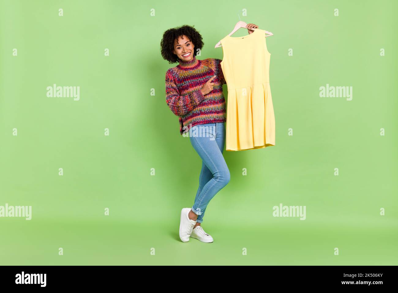 Full size photo of cute millennial curly hairdo lady show dress wear ...