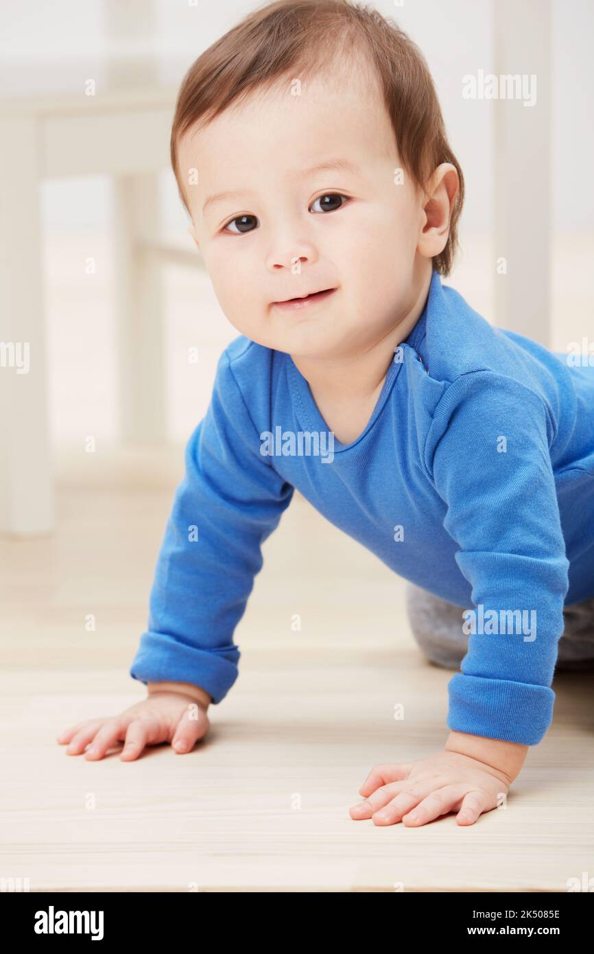 Motoring around the house. Closeup portrait of an adorable baby boy ...