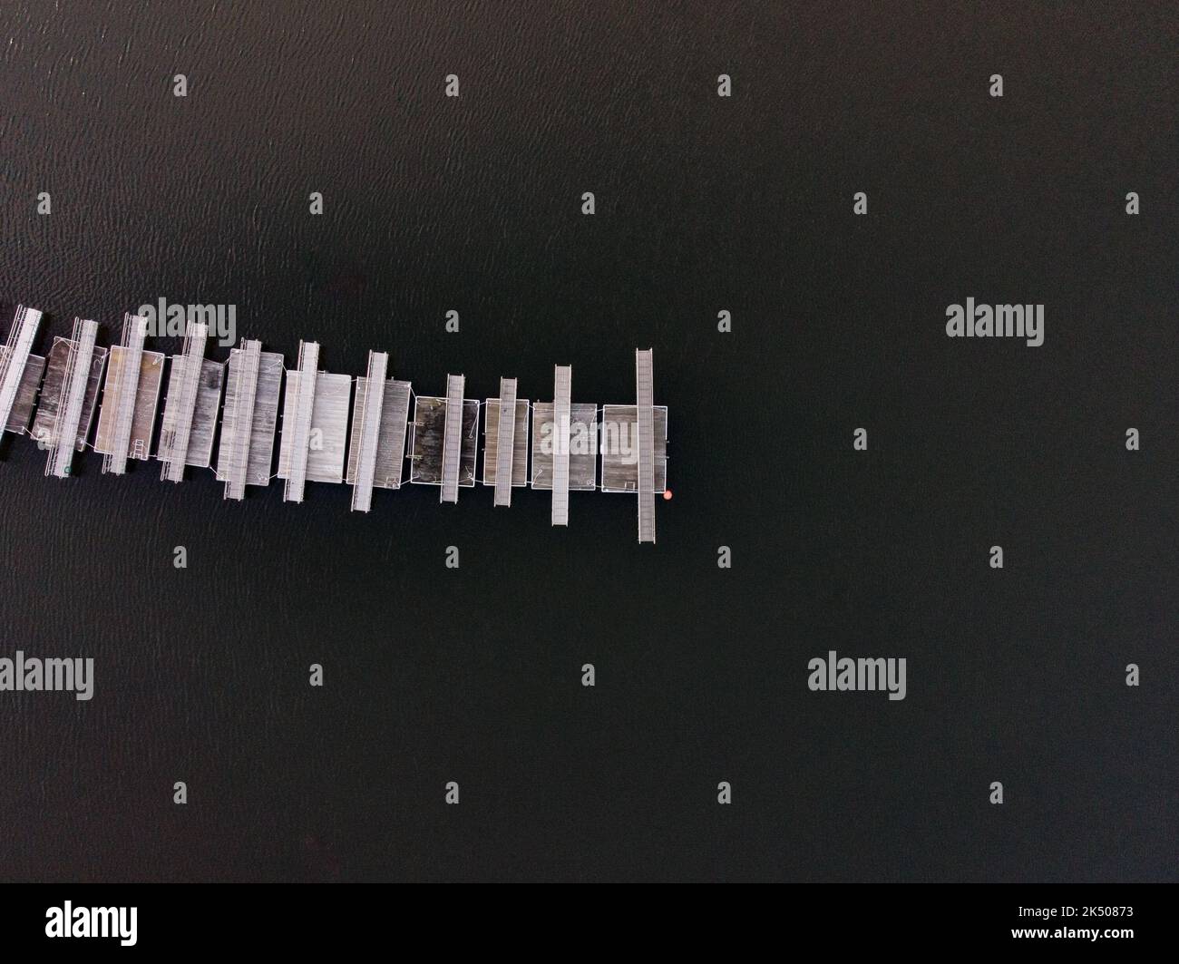 An aerial top view of wooden docks on the sea in Westchester, New York ...
