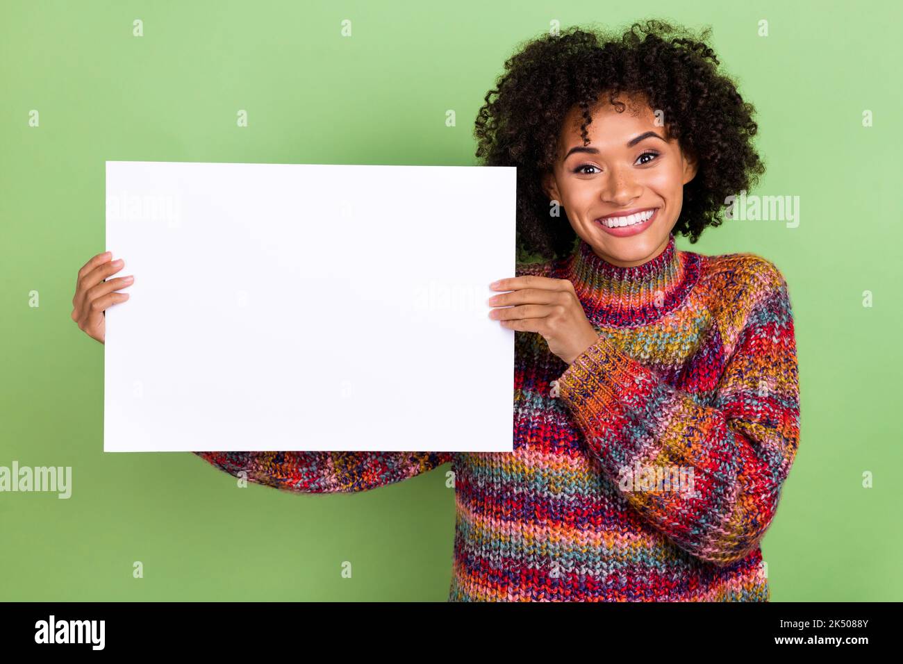 Photo of pretty millennial curly hairdo lady hold placard wear colorful ...