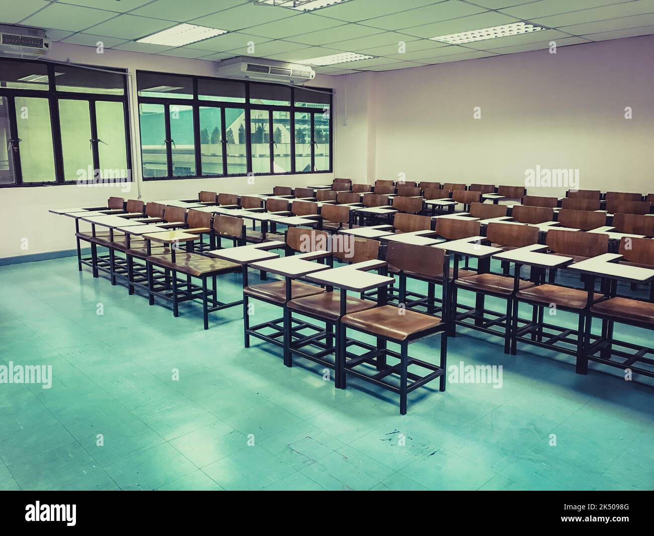 Wooden chairs in the classroom background Stock Photo - Alamy