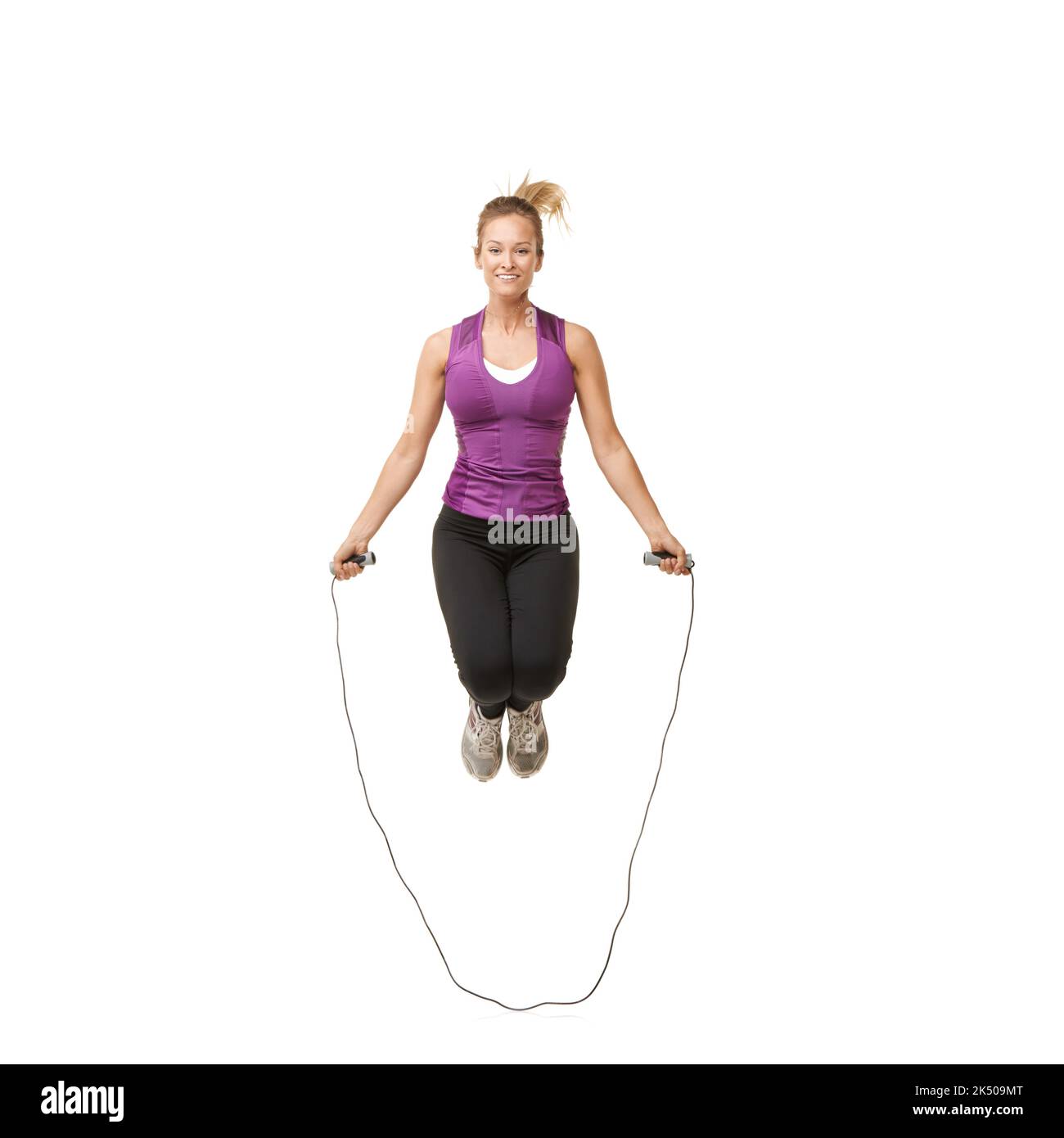 Addicted to jumping. Portrait of an attractive young woman jumping high ...