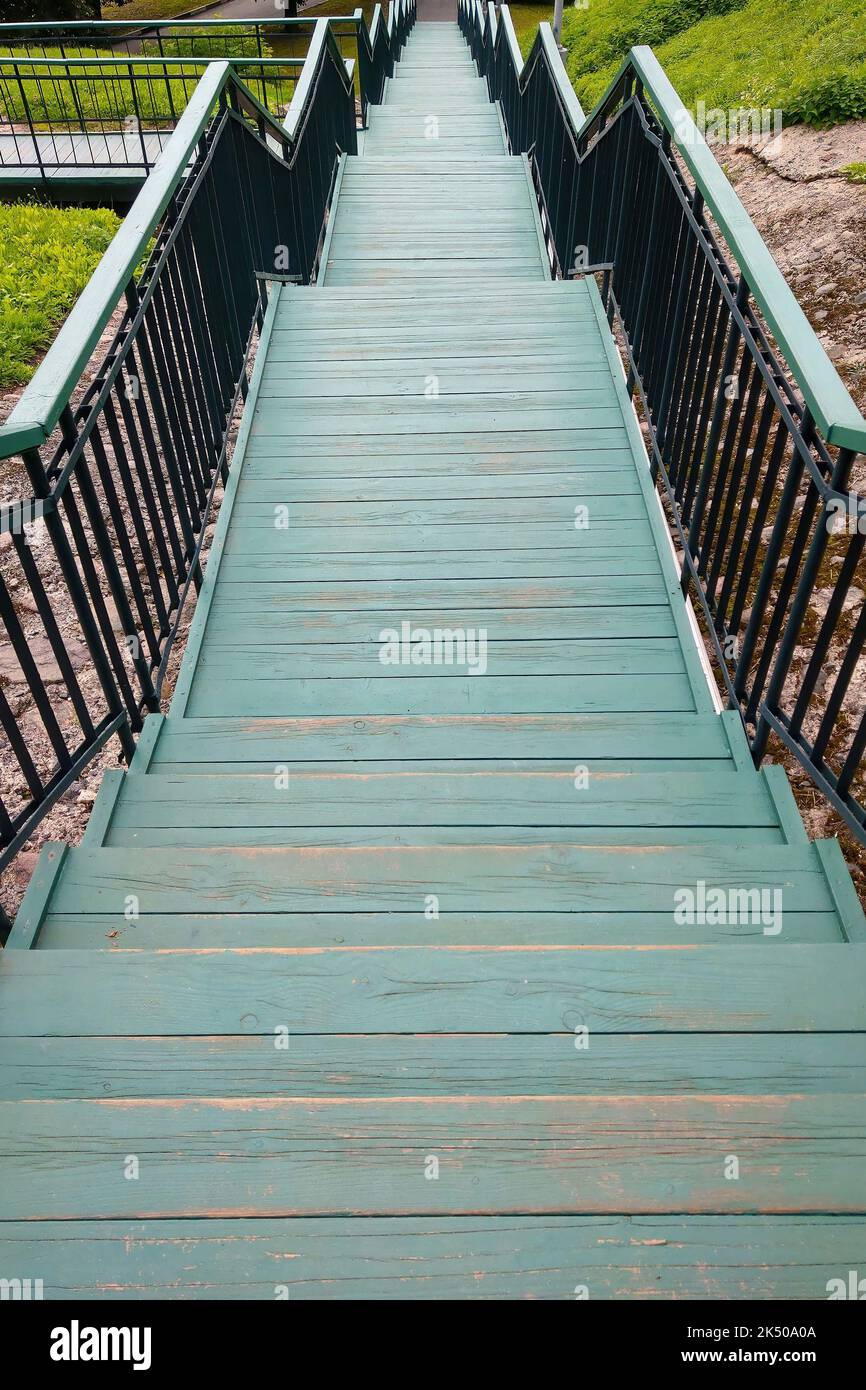 A vertical shot of the descent on the wooden stairs at the park Stock ...