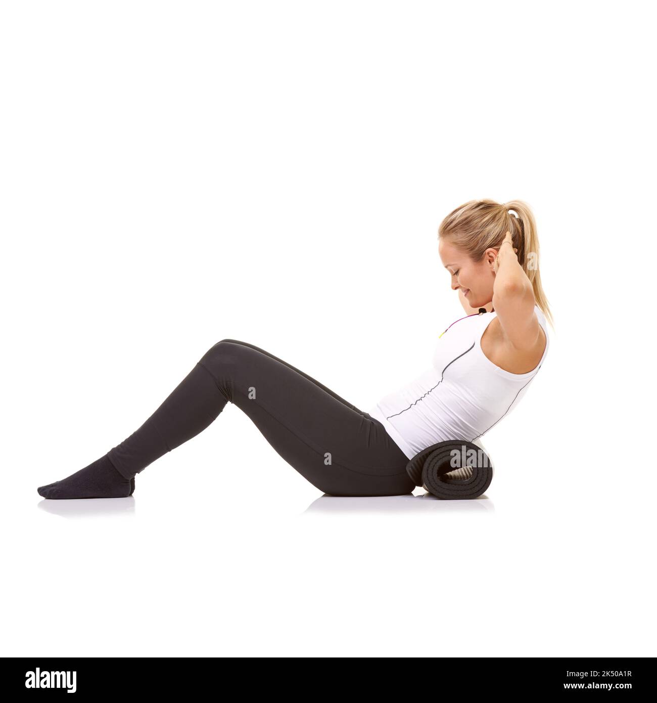 She can see the results already. A pretty young woman working out with ...