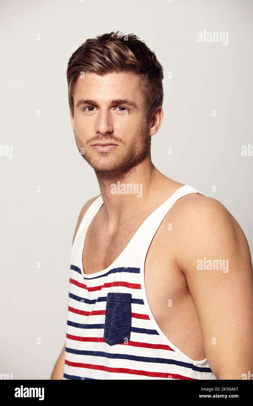 Hes got that laid-back charm...Studio portrait of a handsome young man ...