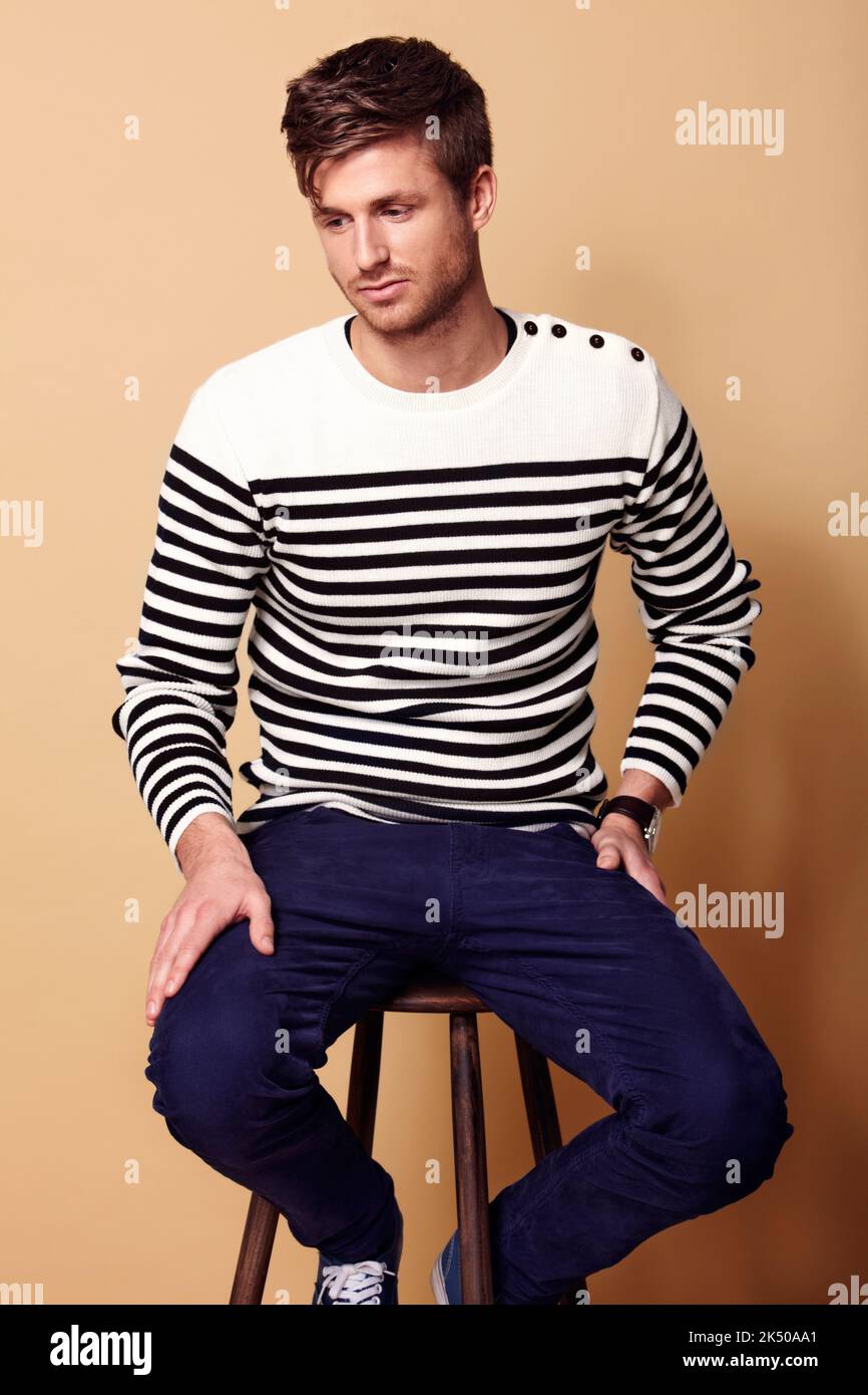 Portrait of quiet confidence. Studio shot of a stylishly-dressed young ...