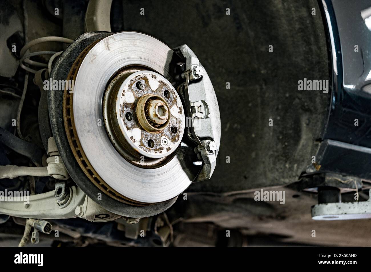 Steel brake disc with pad in car service Stock Photo - Alamy