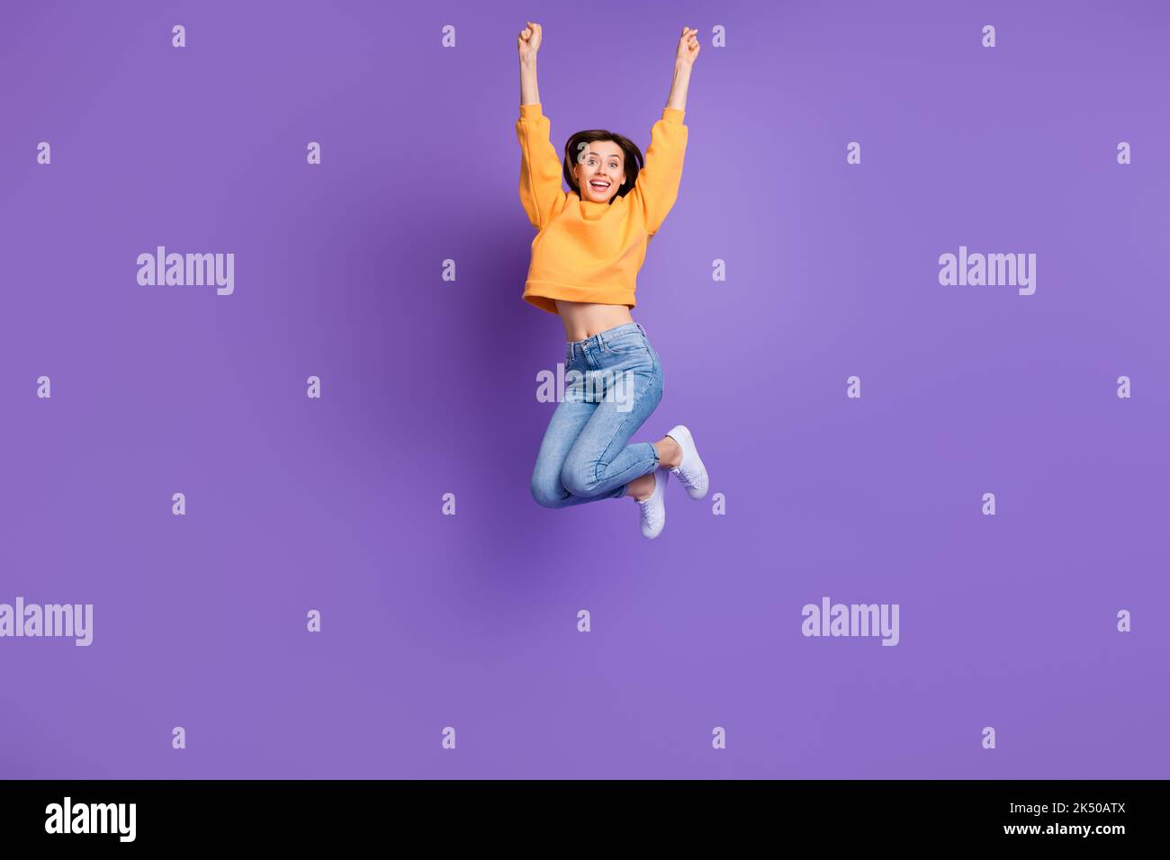Full size photo of young crazy excited woman jump trampoline fists up ...