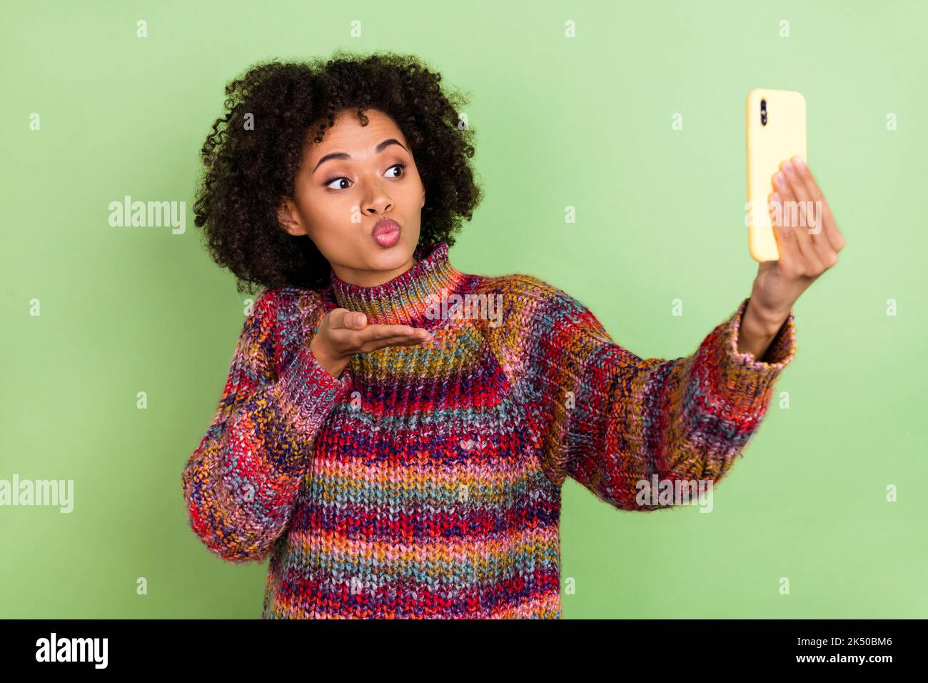 Photo Of Flirty Young Curly Hairdo Lady Blow Kiss Wear Red Sweater