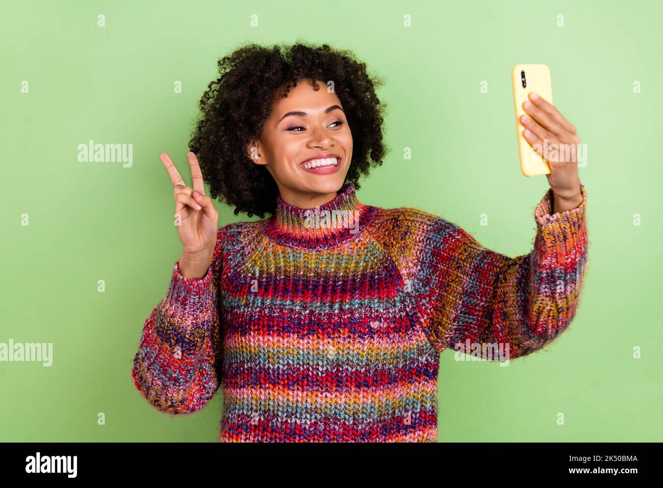 Photo of funky millennial curly hairdo lady show v-sign wear red ...
