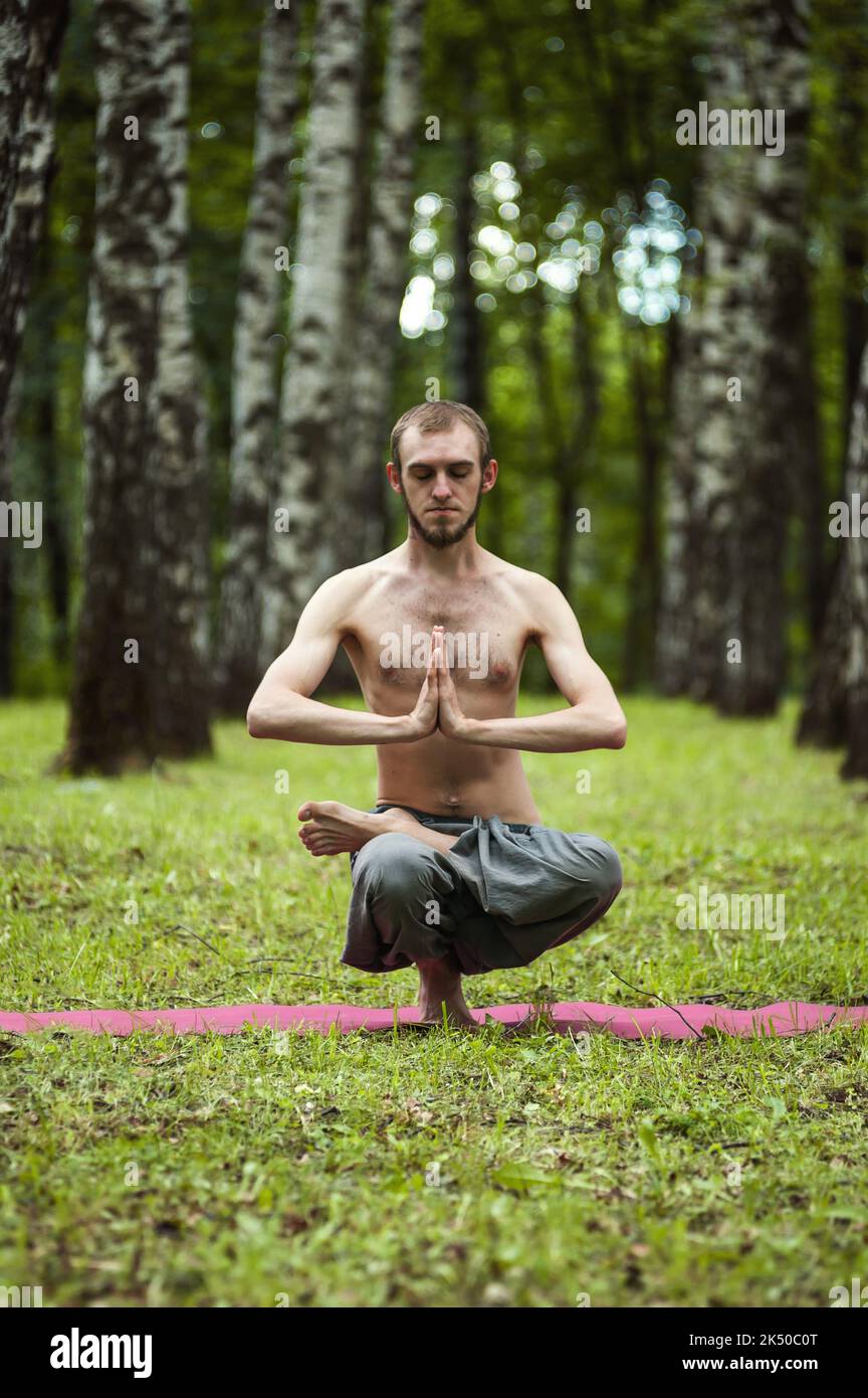 Yoga man meditating at sunset. Male model of meditation in serene ...