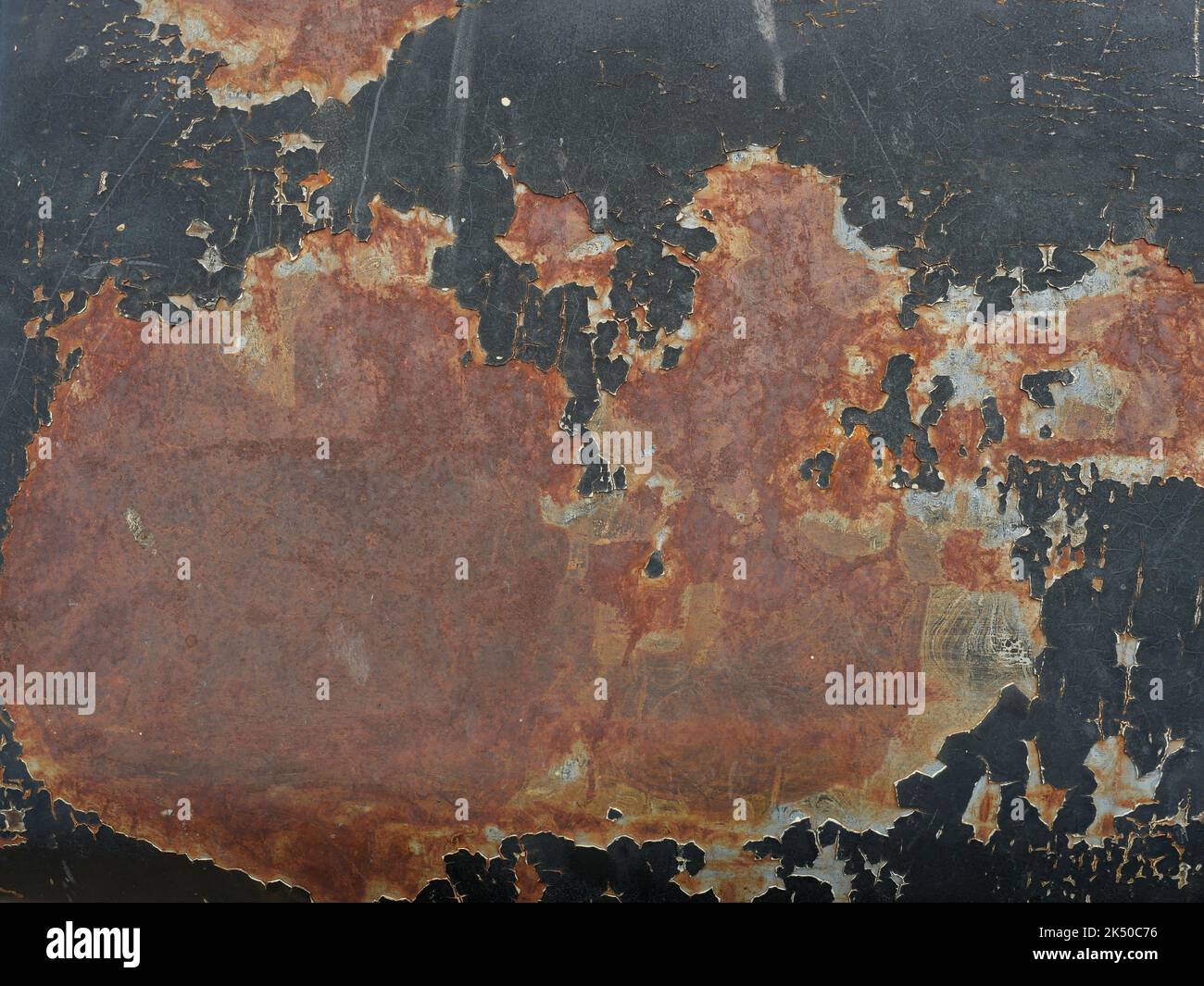 Brown rust stain on the black with blue with green with gray and silver ...