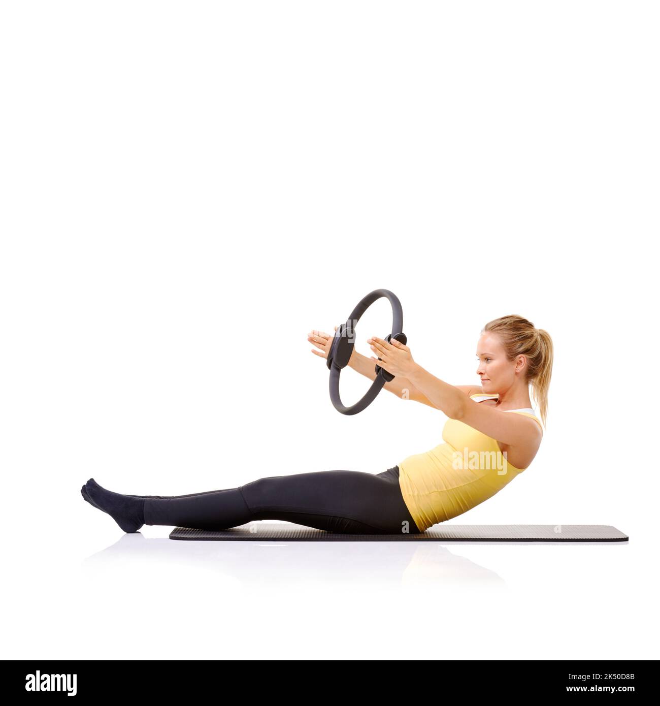 Pilates ring requires balance and strength. A pretty young blonde ...
