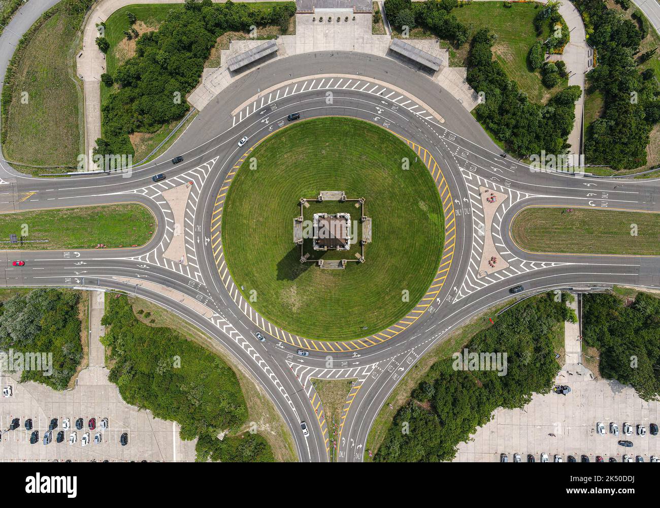 An aerial view of roundabout intersection in several directions with ...