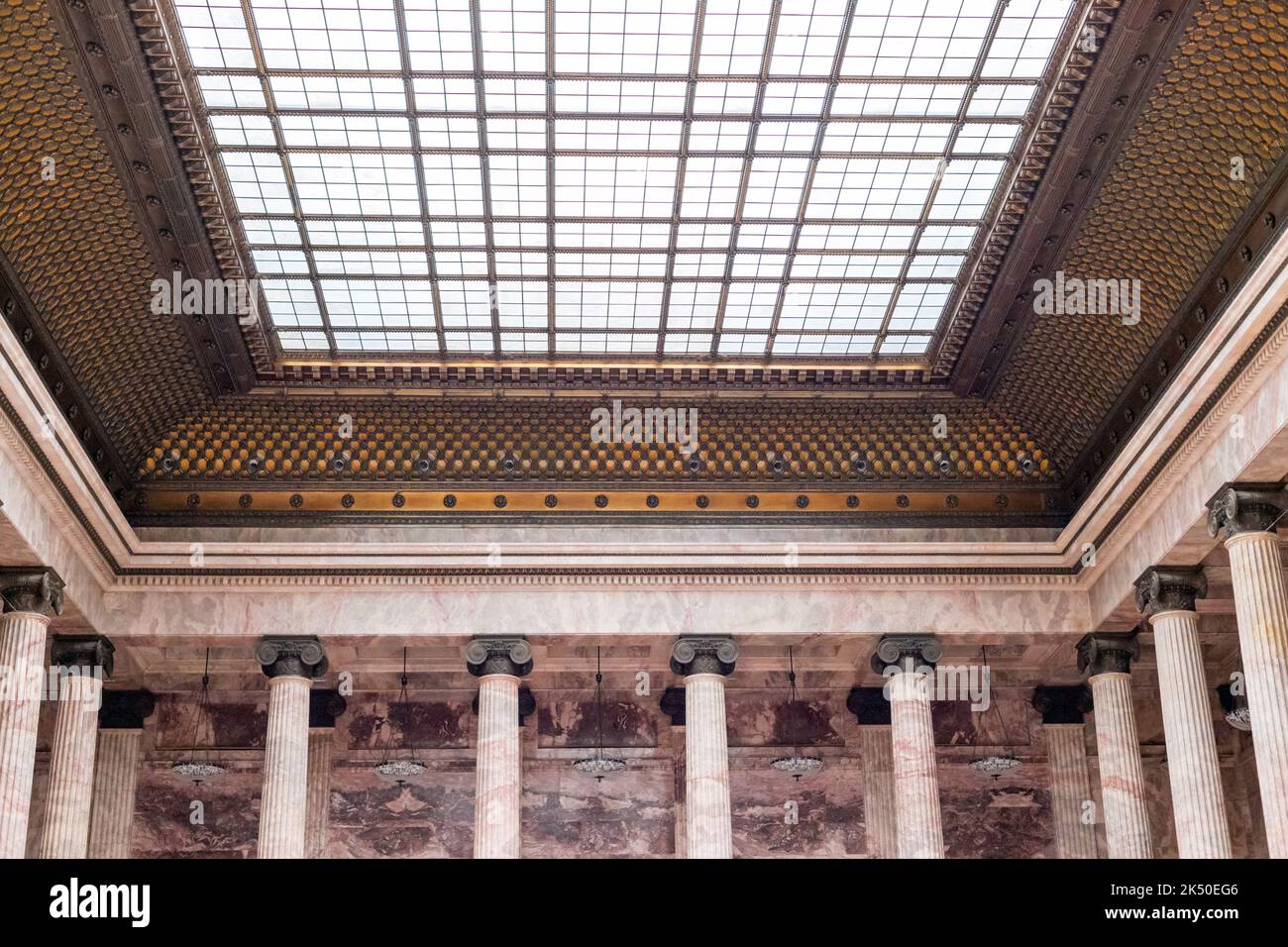 Hall interior with pink marble, colonnade and glass dome or glass roof ...