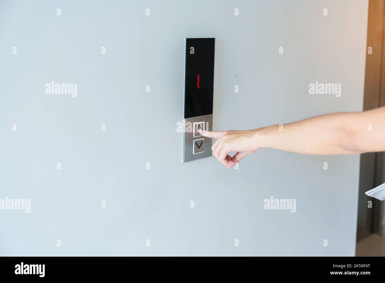 Hand finger press the Elevator button, woman waiting for Elevator in ...