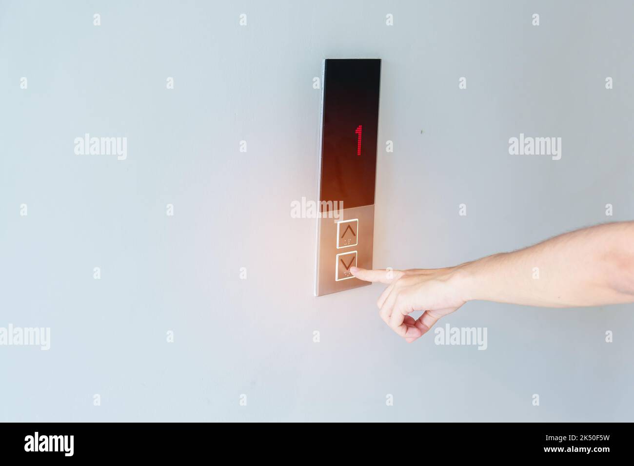 Hand finger press the Elevator button, woman waiting for Elevator in ...