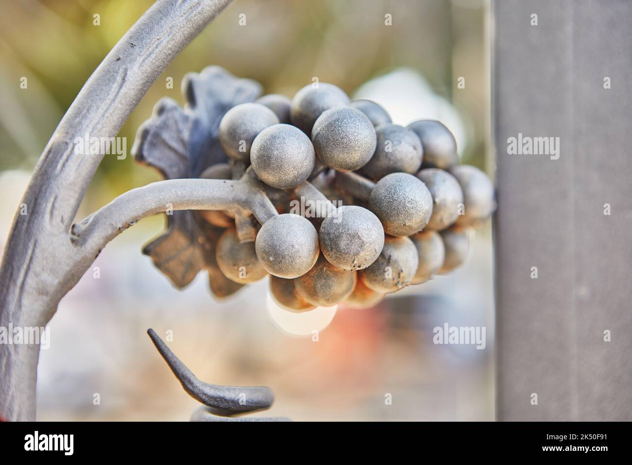 Grapevine made of metal at the entrance gate to the house Stock Photo ...