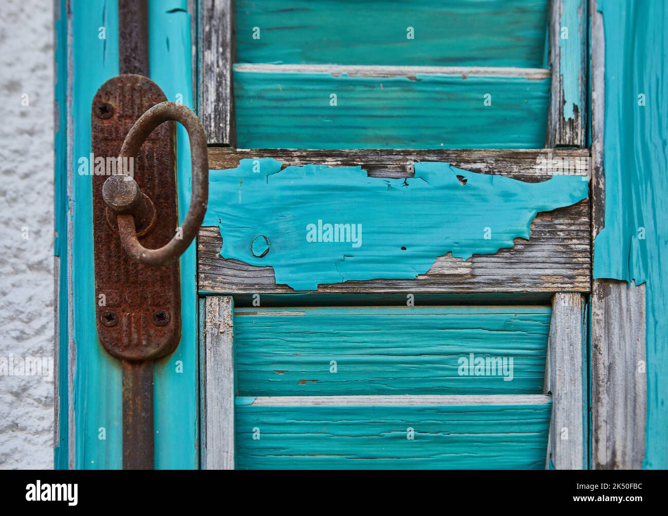 Wooden windows and shutters painted blue in house at sunset Stock Photo ...