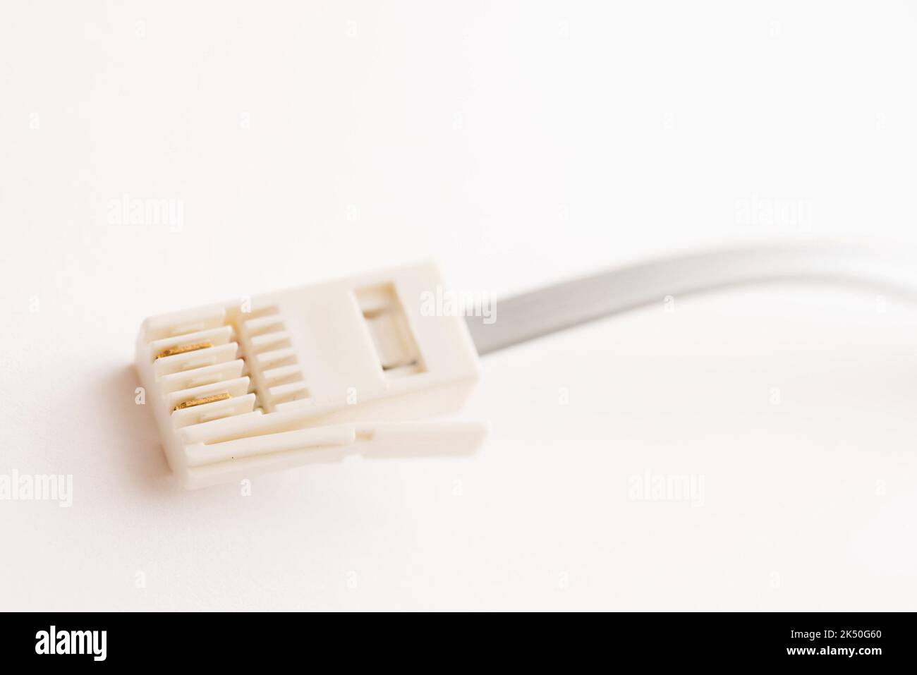 Plug of phone connector cable against white background Stock Photo - Alamy