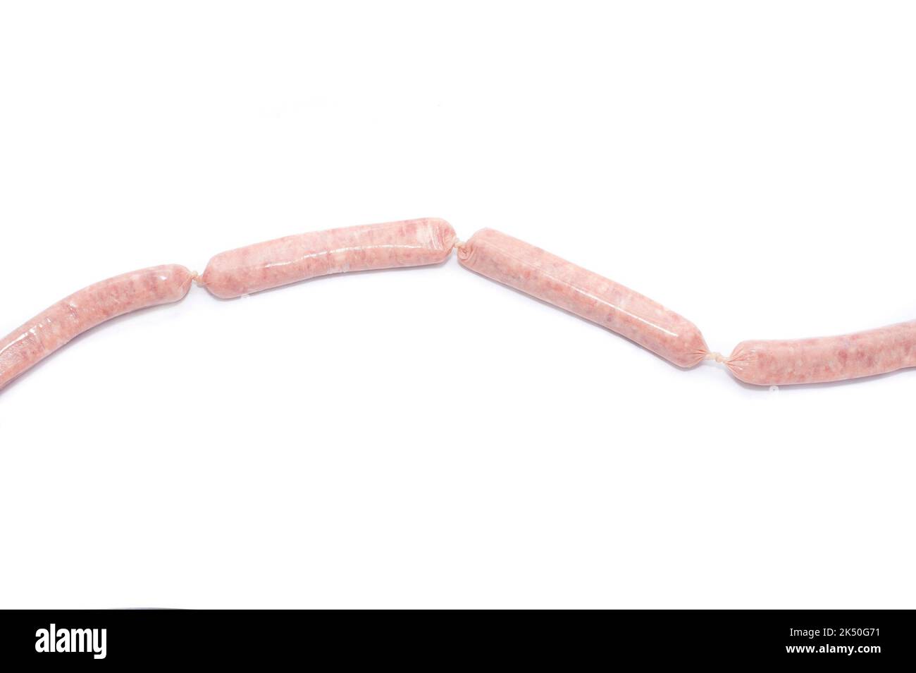 Long line of linked uncooked pork sausages for a delicious quick meal ...