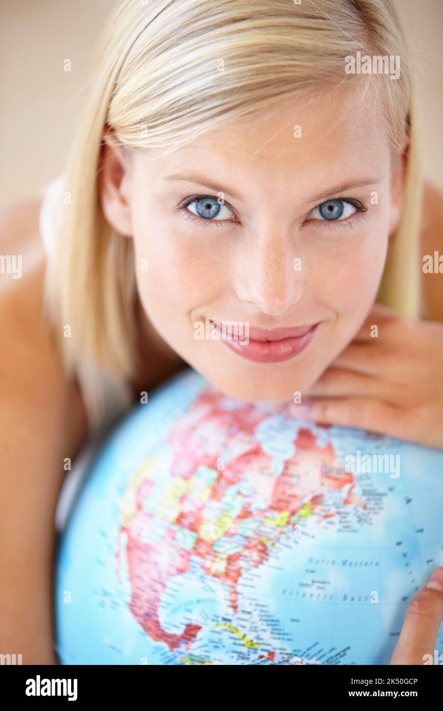 Protect our earth. Closeup of a pretty young woman hugging a globe of ...