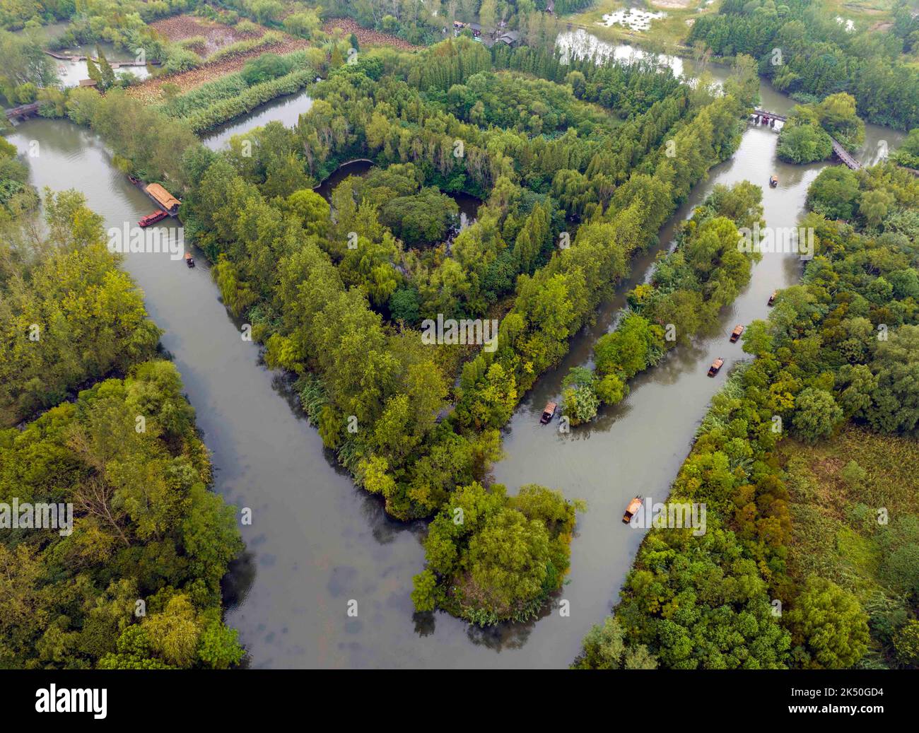 TAIZHOU, CHINA - OCTOBER 5, 2022 - Aerial photo shows tourists enjoying a boat ride at Qinhu ...