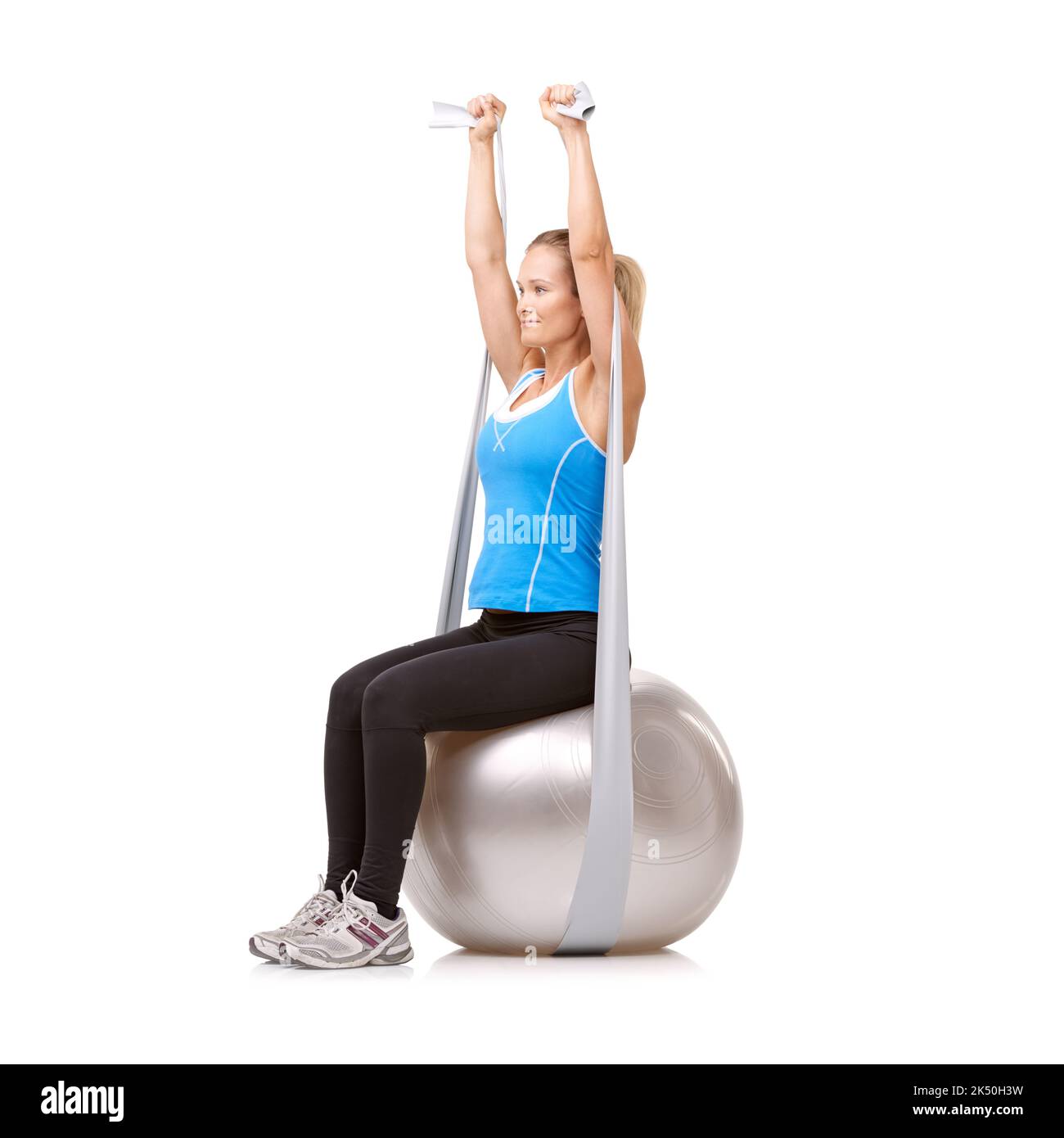 Giving her arms a great workout. A young blonde woman sitting on an ...