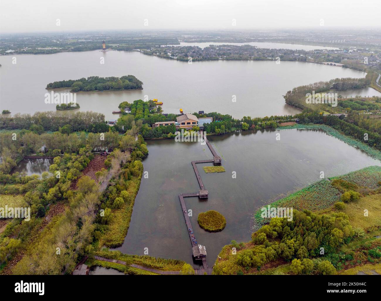TAIZHOU, CHINA - OCTOBER 5, 2022 - Aerial photo shows tourists enjoying a boat ride at Qinhu ...