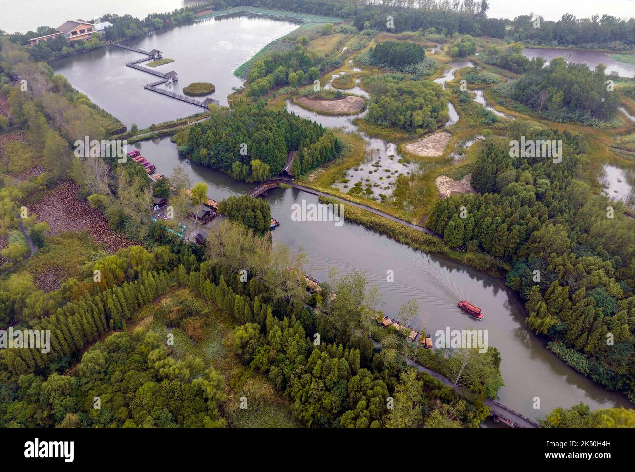 TAIZHOU, CHINA - OCTOBER 5, 2022 - Aerial photo shows tourists enjoying a boat ride at Qinhu ...