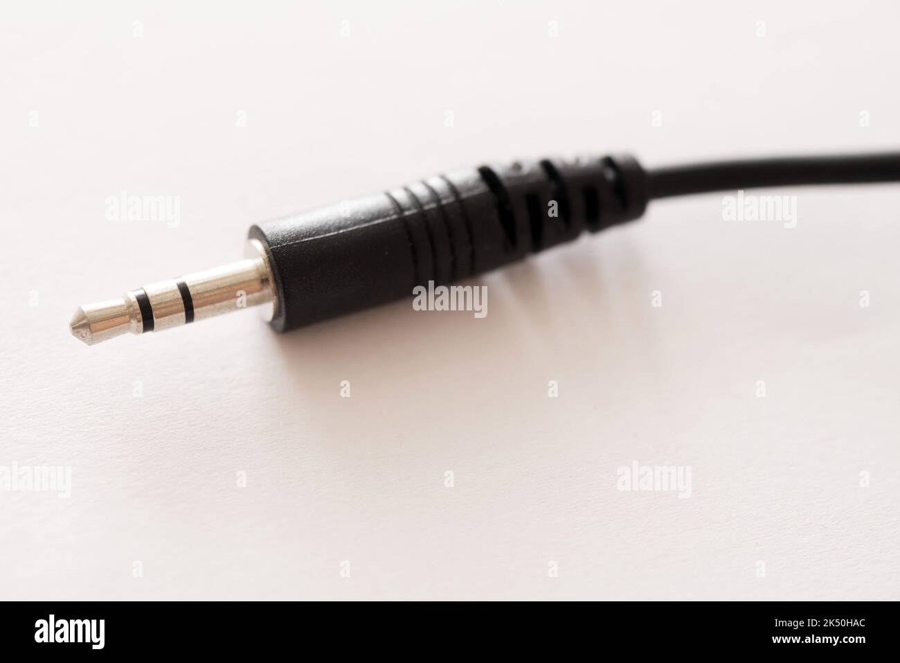 Audio jack plug stereo connector with black plastic body close-up on ...