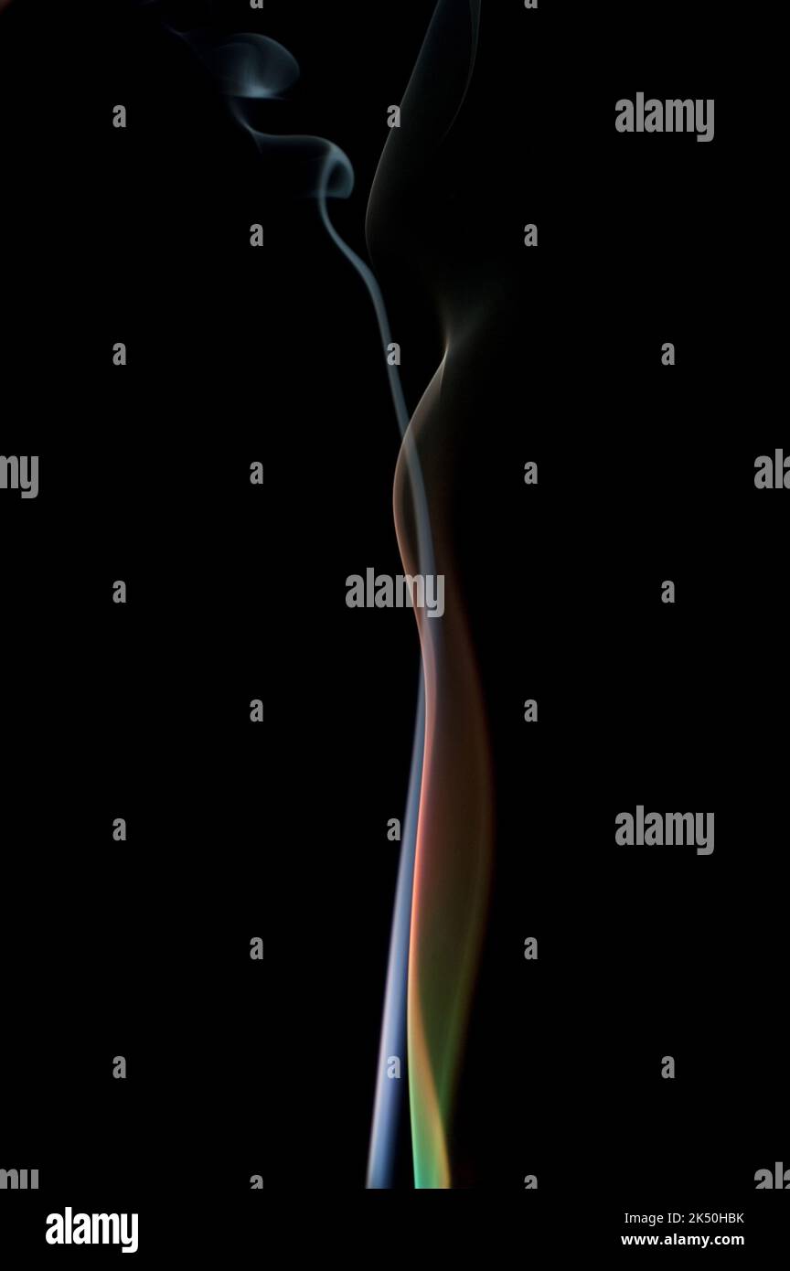 trails of rising smoke shot with colored lights Stock Photo - Alamy