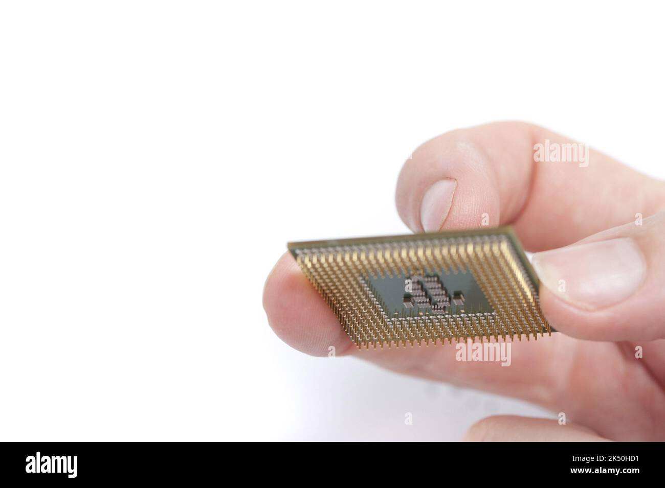 Man holding computer CPU with his fingers, close-up image on white ...
