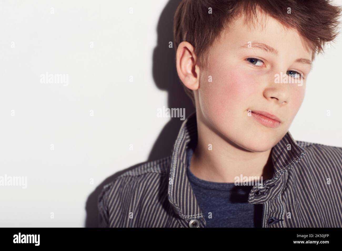 Hes got plenty of confidence. Young adolescent boy looking confident ...