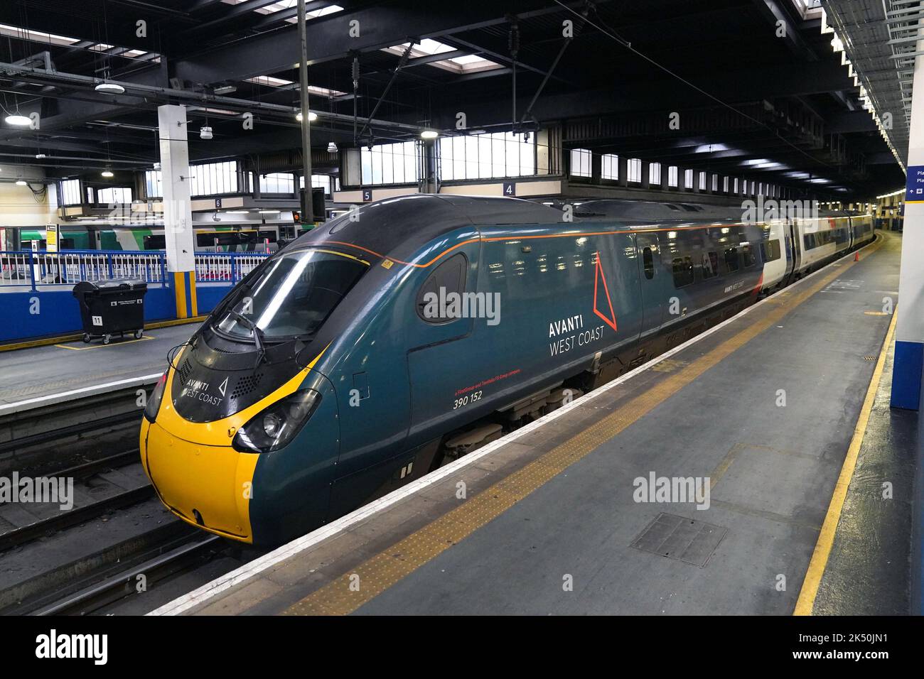 An empty platform and stationary train at Euston station in London, as ...