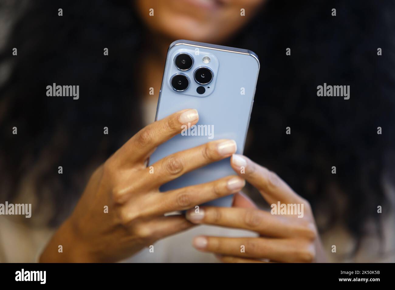 Black woman using mobile phone. African female person browsing app on ...