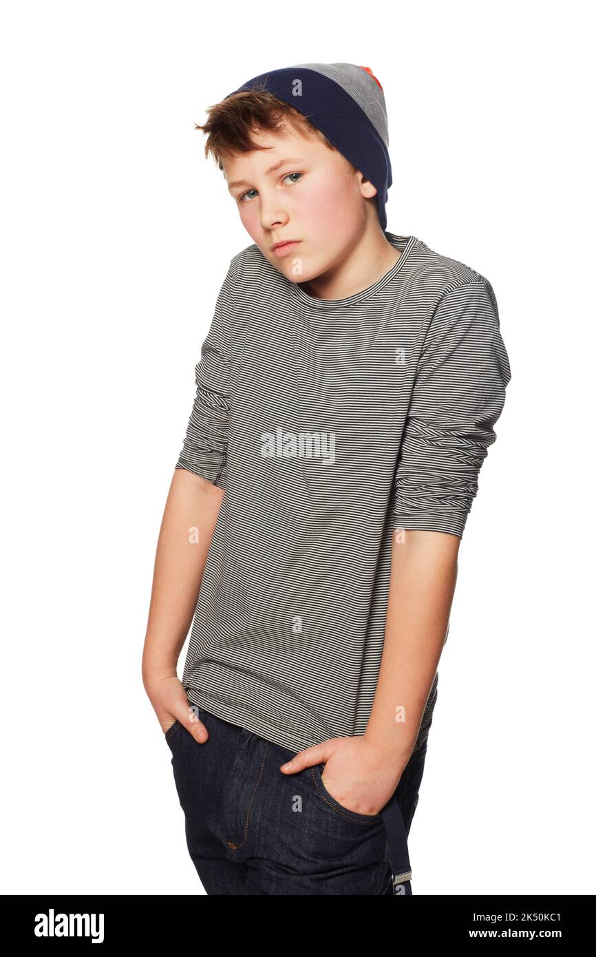 Giving you attitude. A teenage boy with his hands in his pockets Stock ...