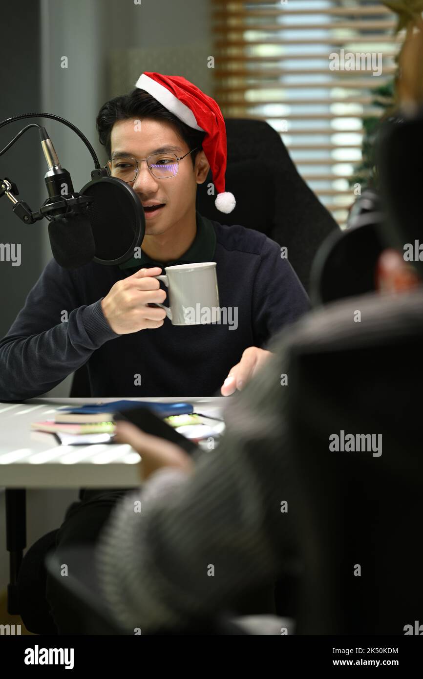 Image of radio host using microphone and laptop to recording podcast in ...