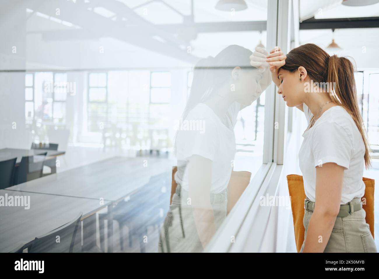 Burnout, frustrated and sad student by classroom window for fail ...