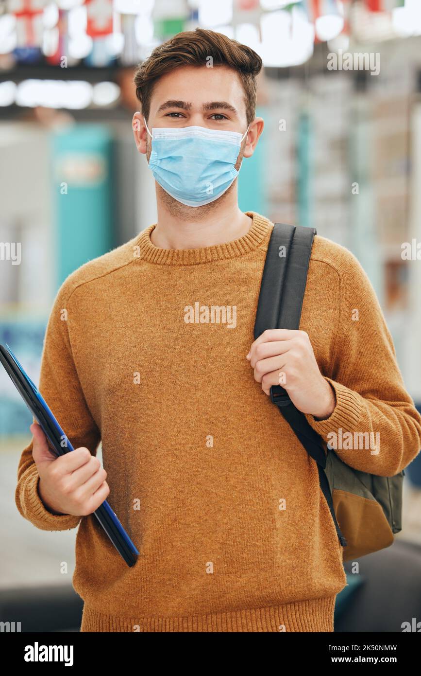 University student and covid portrait of man with face mask protection ...
