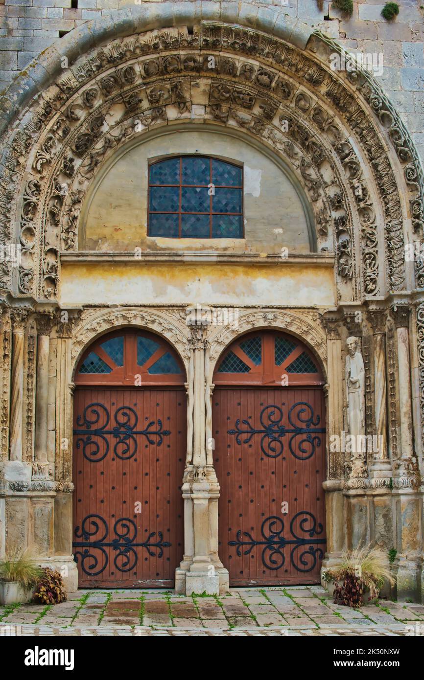 Beautifully decorated portal and double-door entrance to the medieval ...