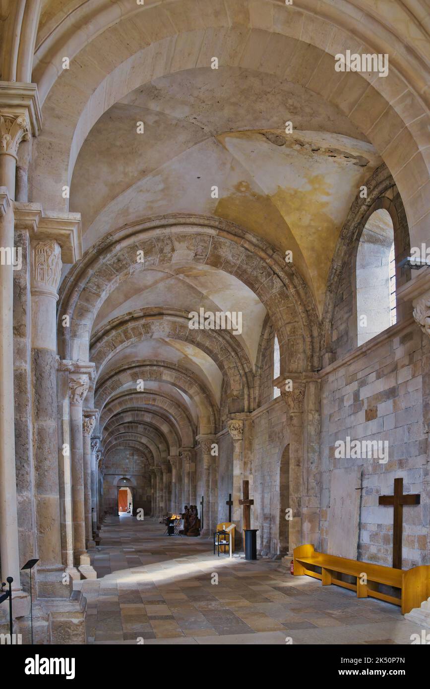 Side aisle with arches of the medieval basilica Sainte-Marie-Madeleine ...