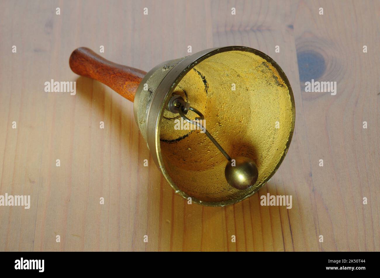 Hand bell with wooden handle Stock Photo - Alamy