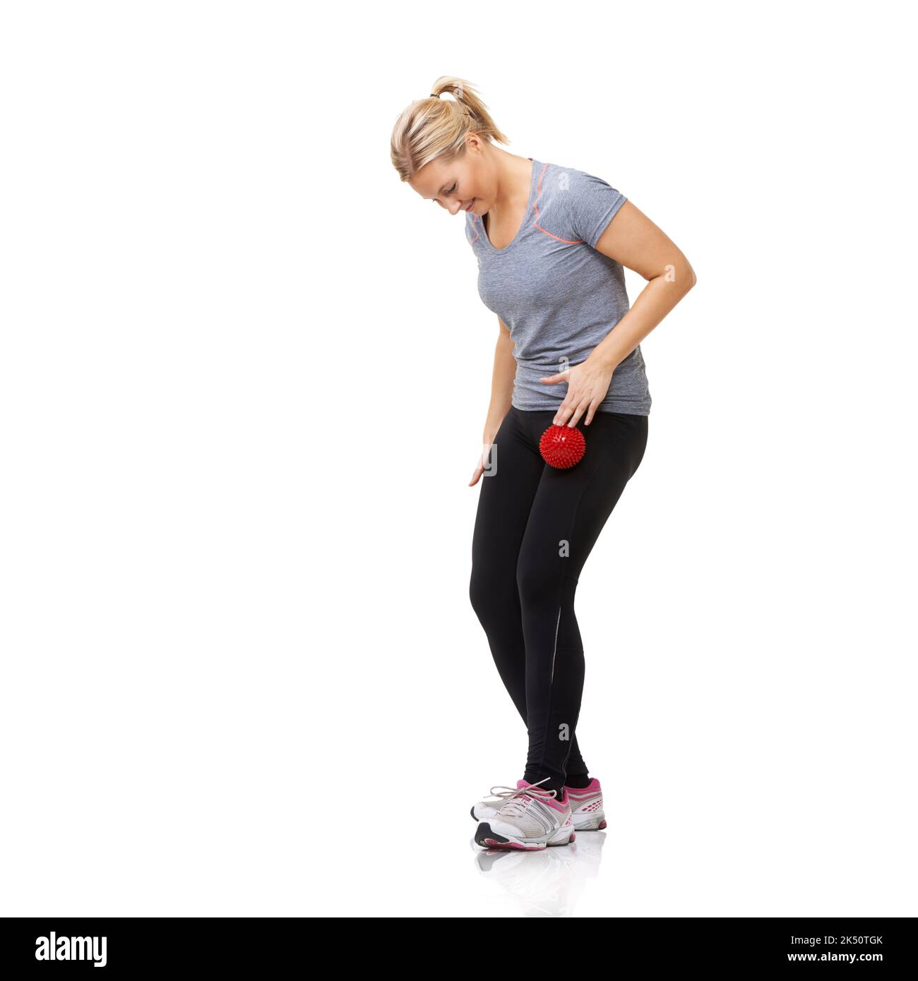 Getting firm thighs. A young woman getting in shape using an exercise ...