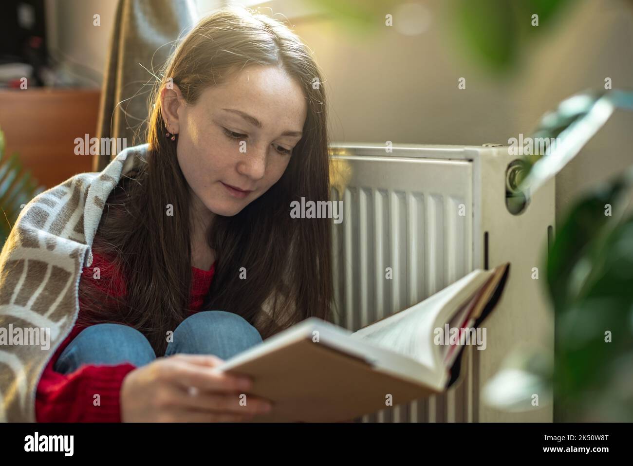 Woman sitting on radiator hi-res stock photography and images - Alamy