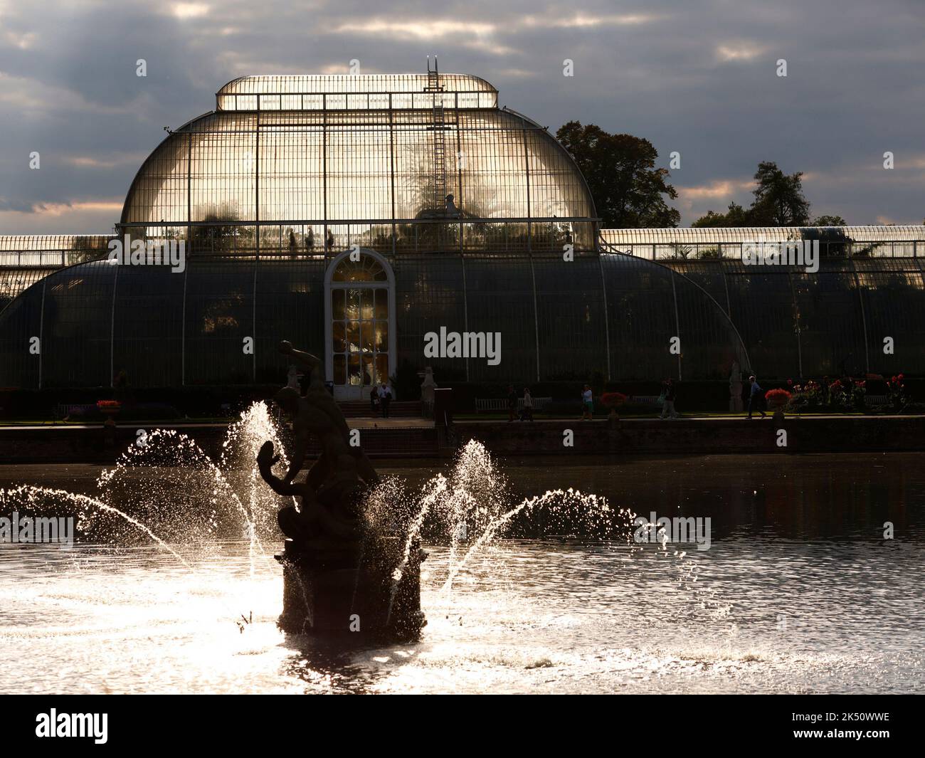 View of the Palmhouse and statue of the Hercules Water Fountain at Kew ...