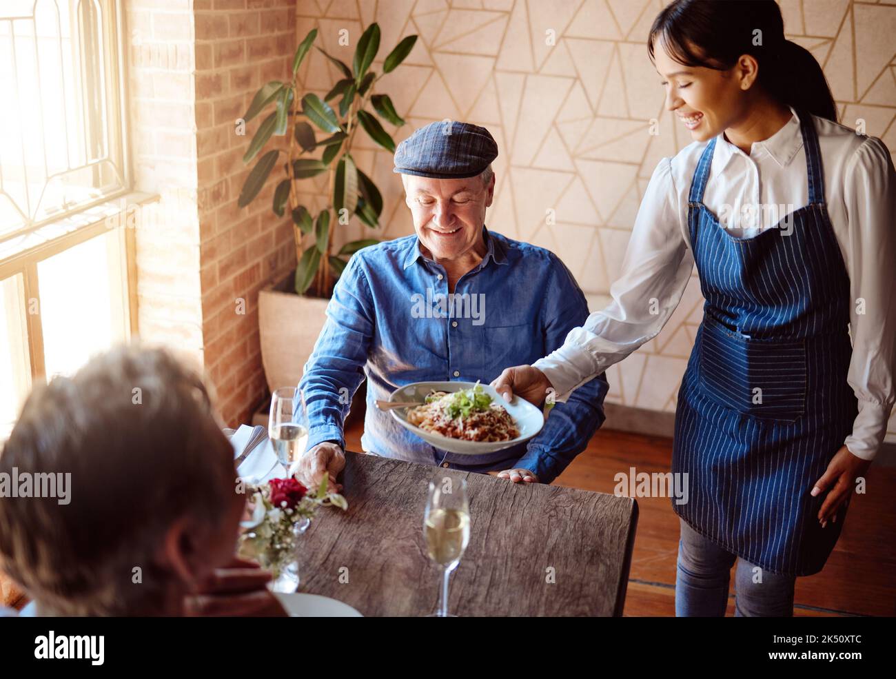 Love, food and old couple in restaurant with waiter on date for romance ...