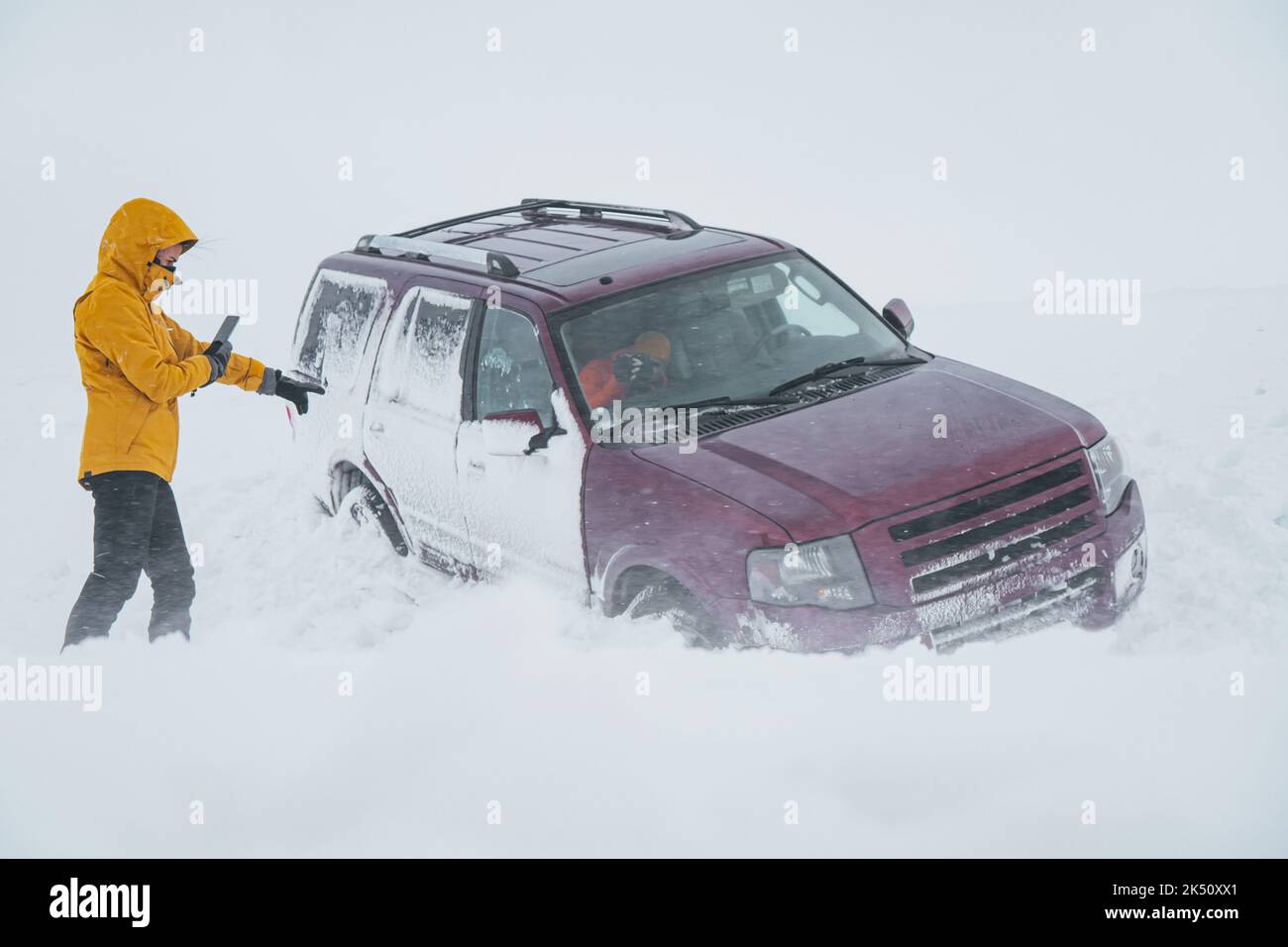 woman making a video call with her insurance to show her the damage to the car due to leaving ...