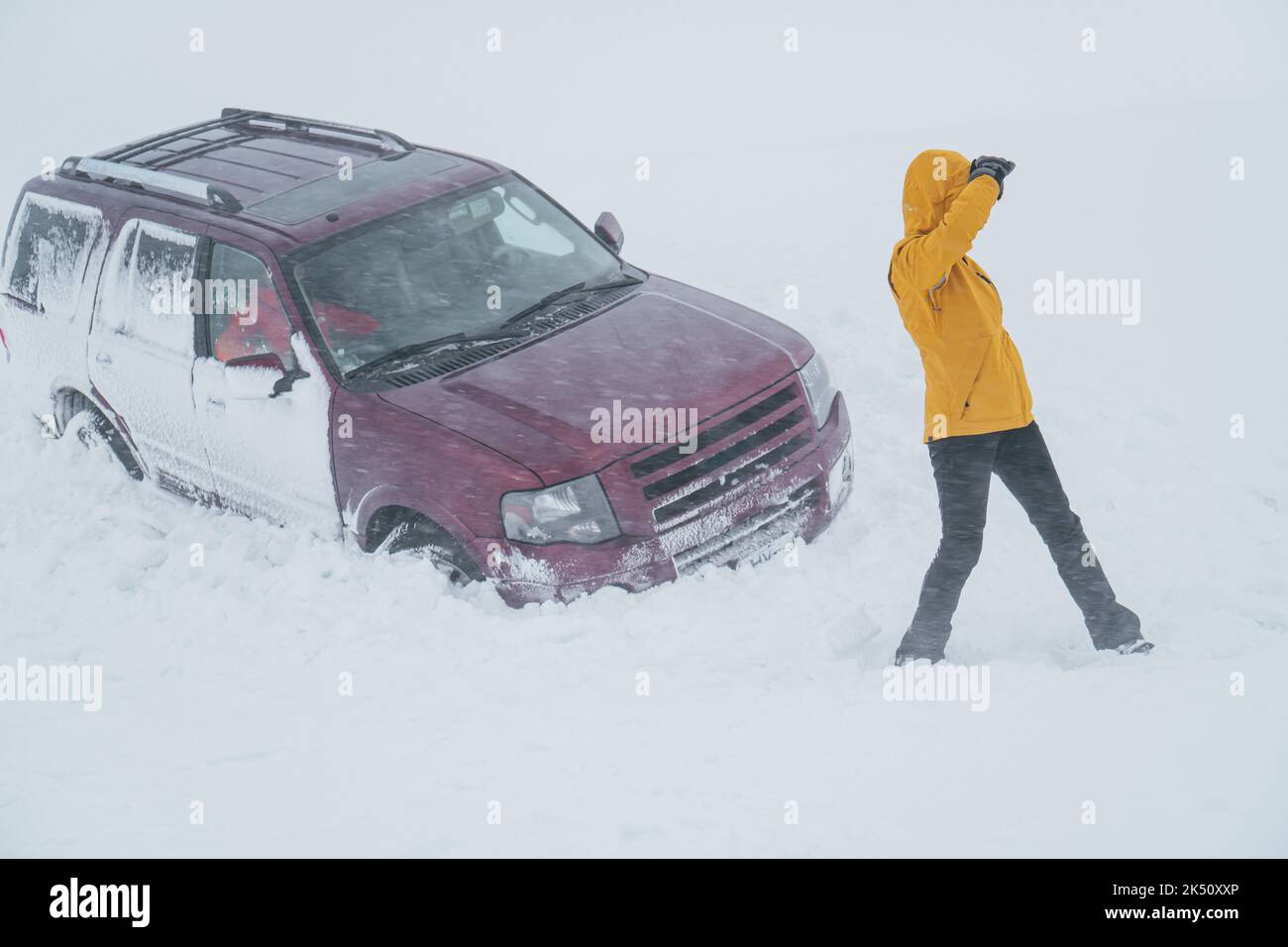 Woman gets out of the car to seek help after a traffic accident Stock ...