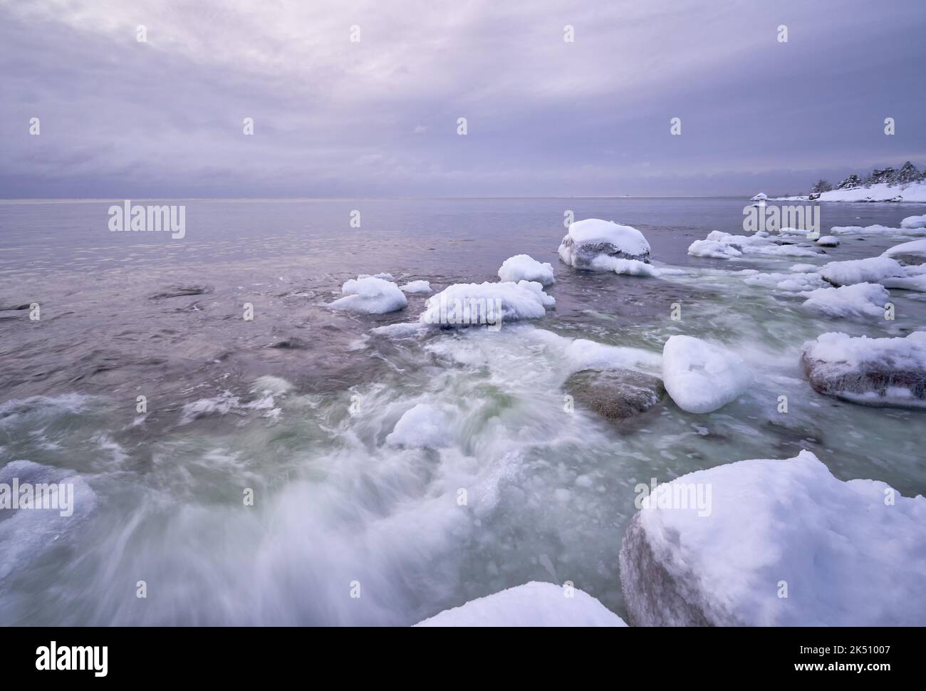 A magic seascape covered by ice and snow, long exposure Stock Photo - Alamy
